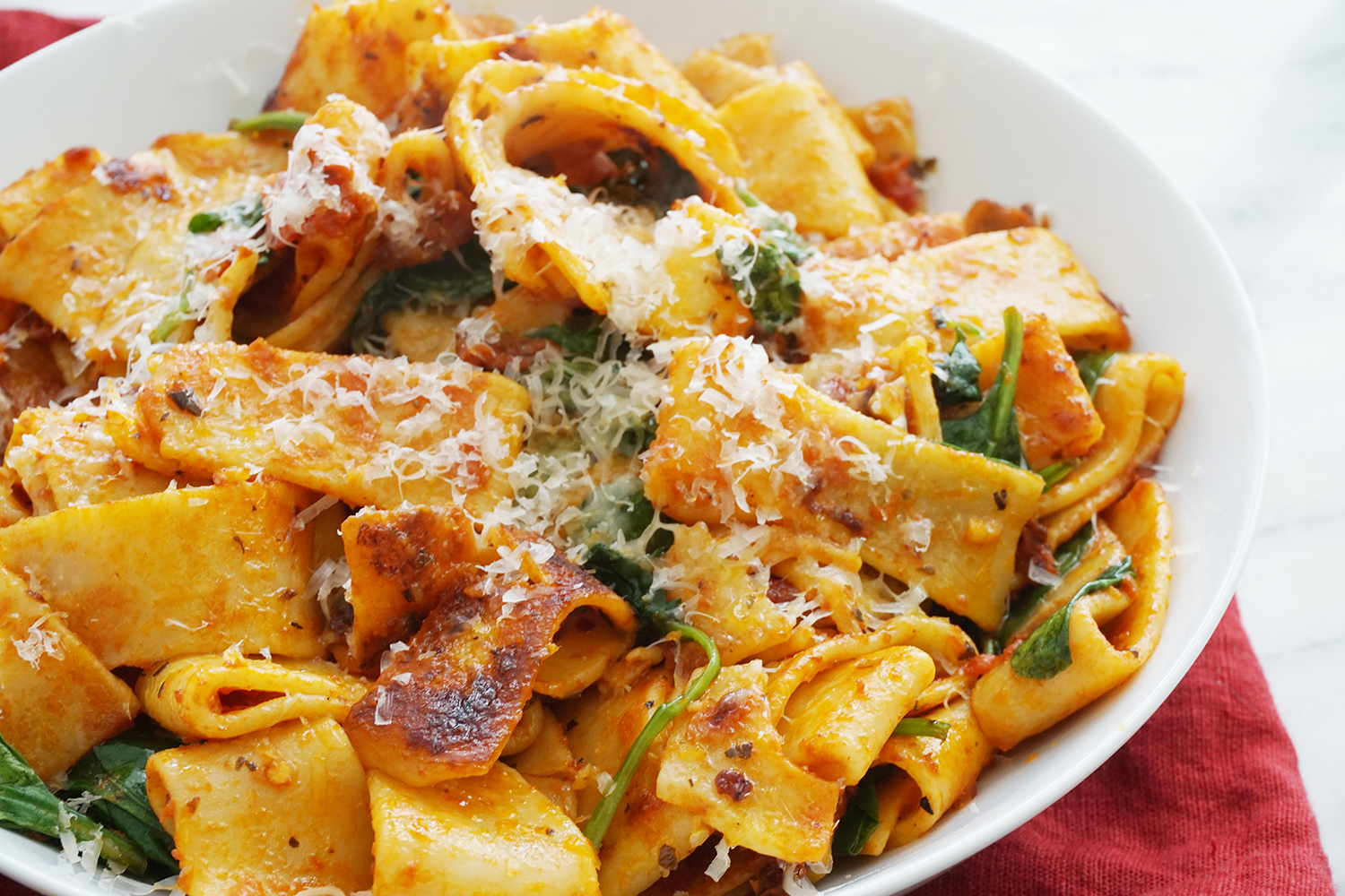 What is the best way to reheat cooked pasta?