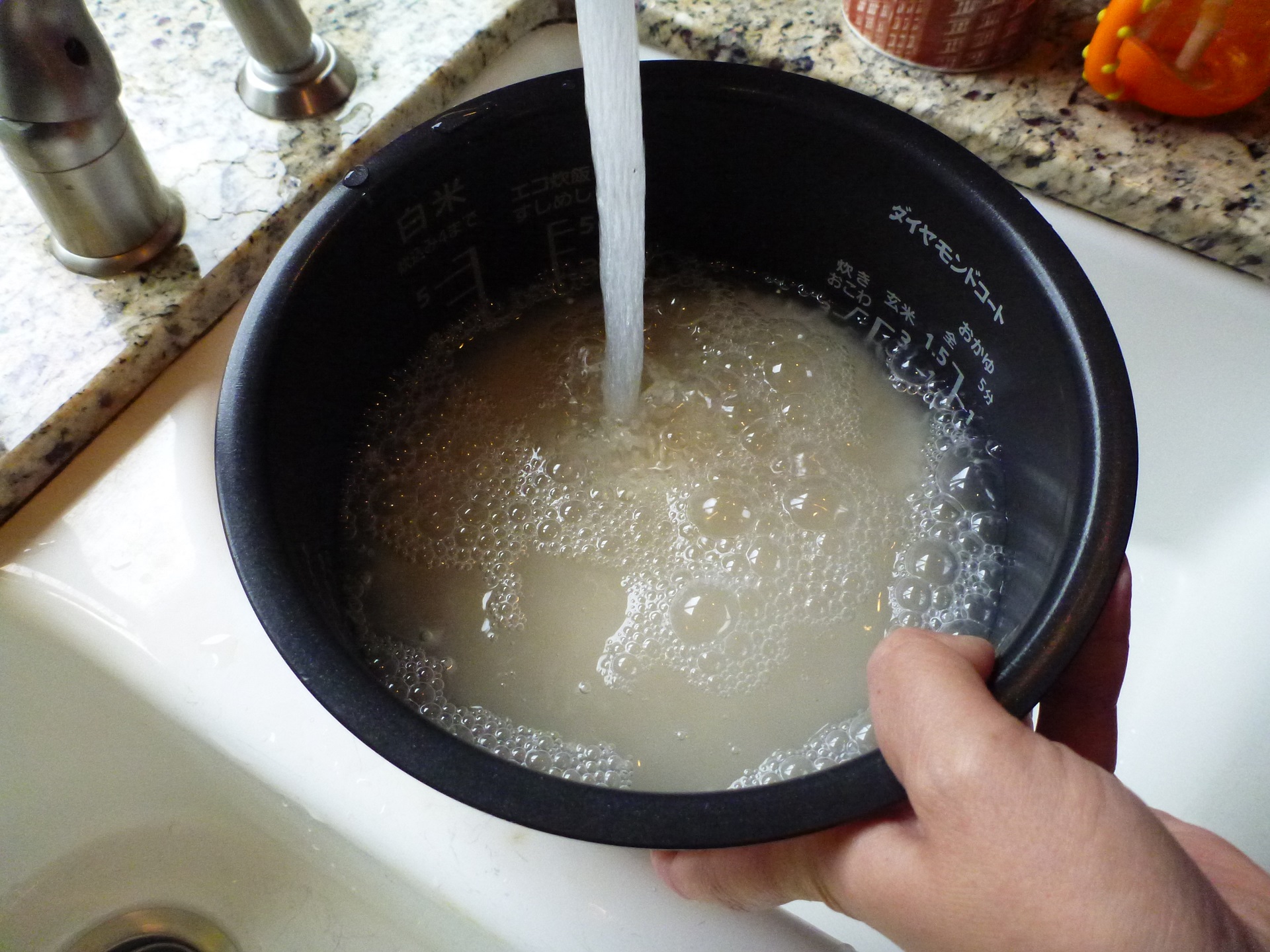 Why do Japanese wash rice?