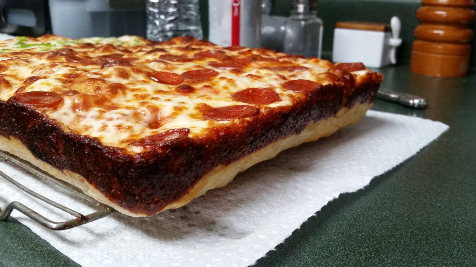 What is the difference between Chicago and Detroit-style pizza?